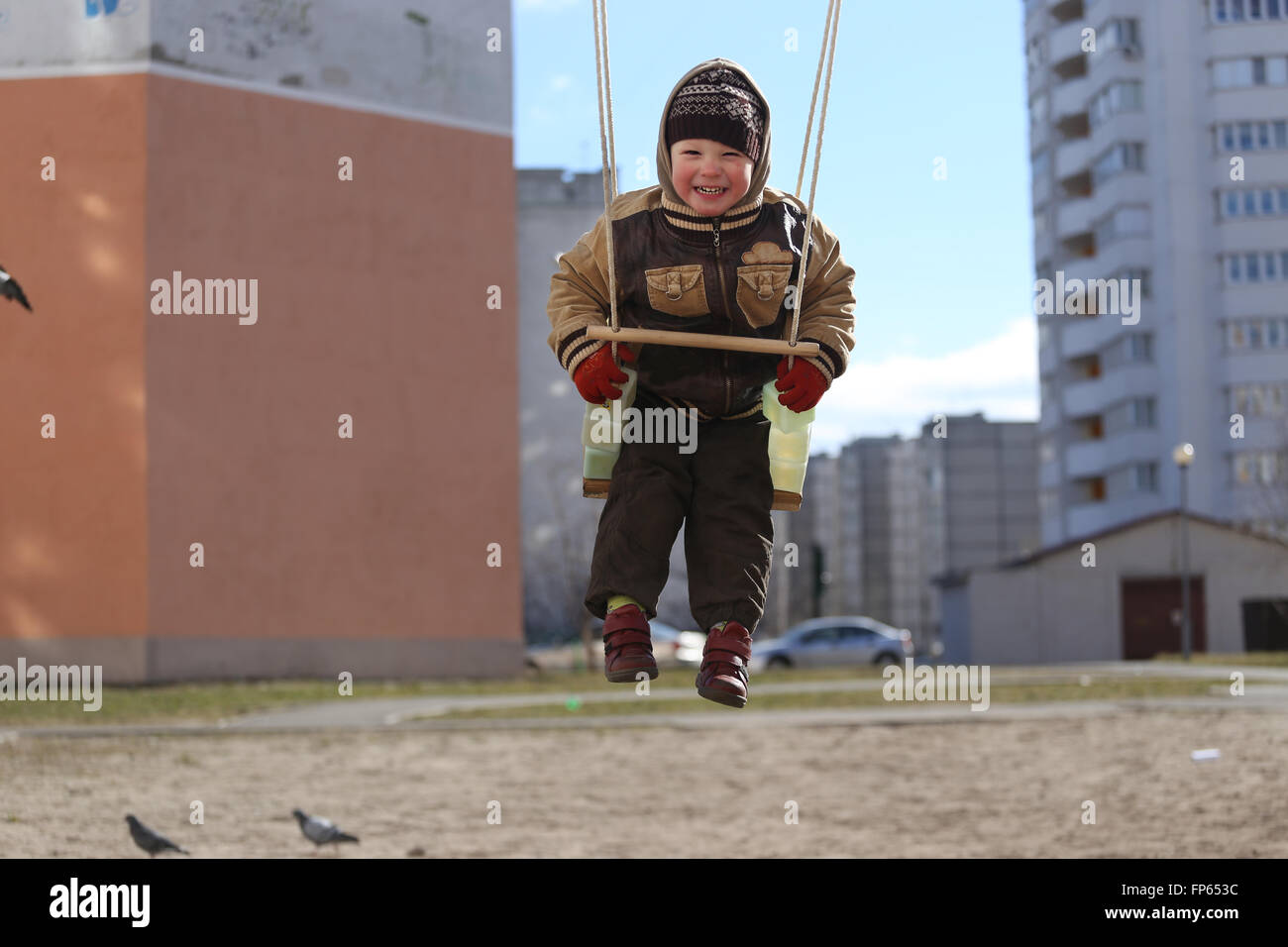 children play on the playground. early spring Stock Photo - Alamy