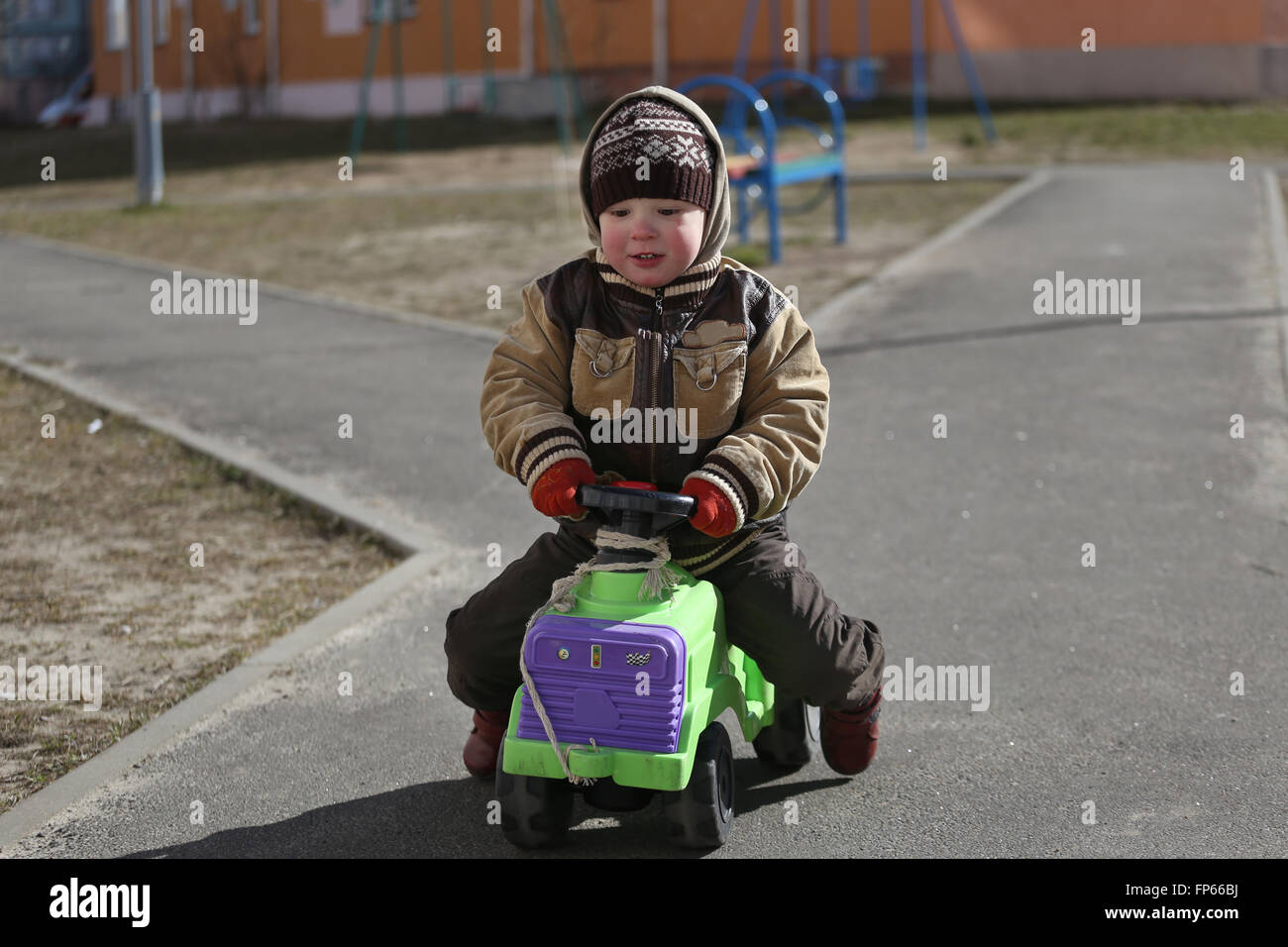 children play on the playground. early spring Stock Photo - Alamy