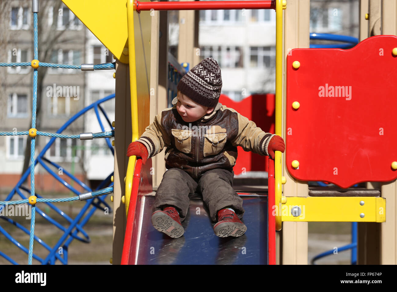 children play on the playground. early spring Stock Photo - Alamy