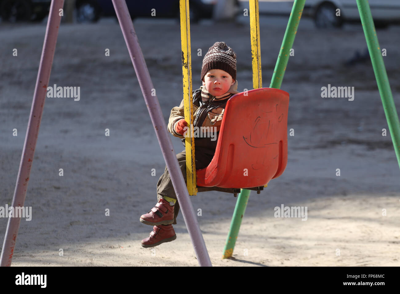 children play on the playground. early spring Stock Photo - Alamy