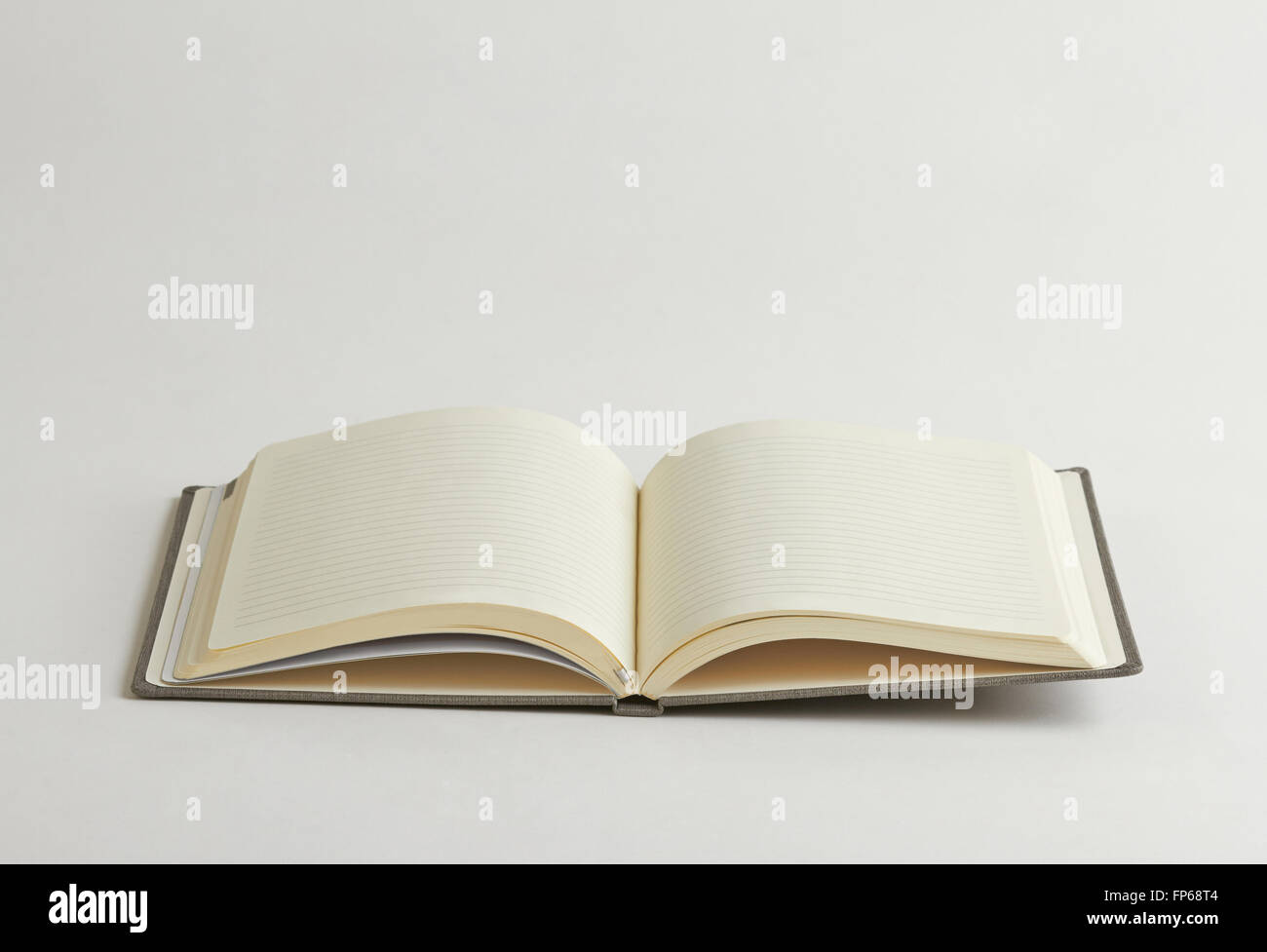 opened notebook isolated on white background Stock Photo - Alamy