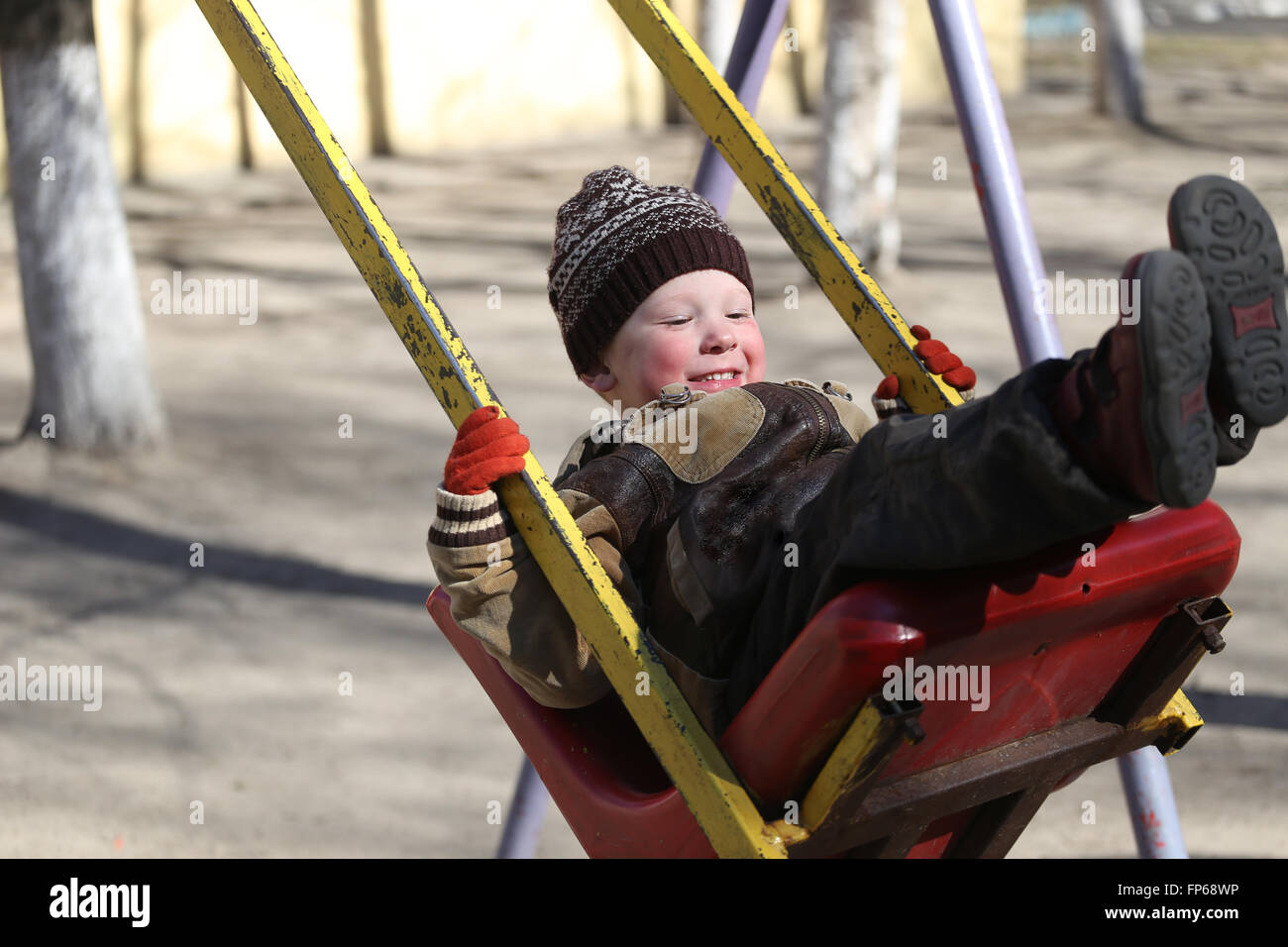 children play on the playground. early spring Stock Photo - Alamy