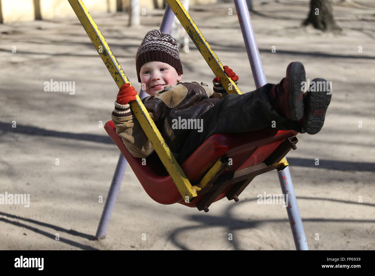 children play on the playground. early spring Stock Photo - Alamy