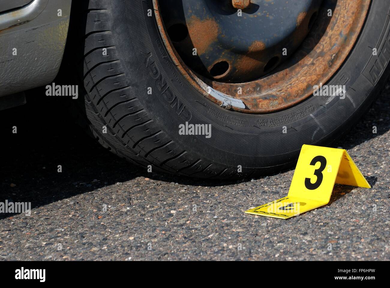 Crime Scene Evidence Marker Near to Tire Stock Photo - Alamy