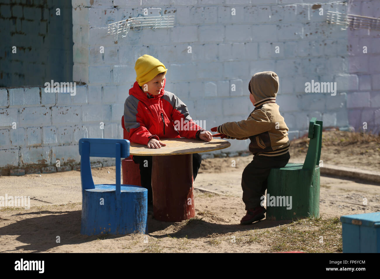 children play on the playground. early spring Stock Photo - Alamy
