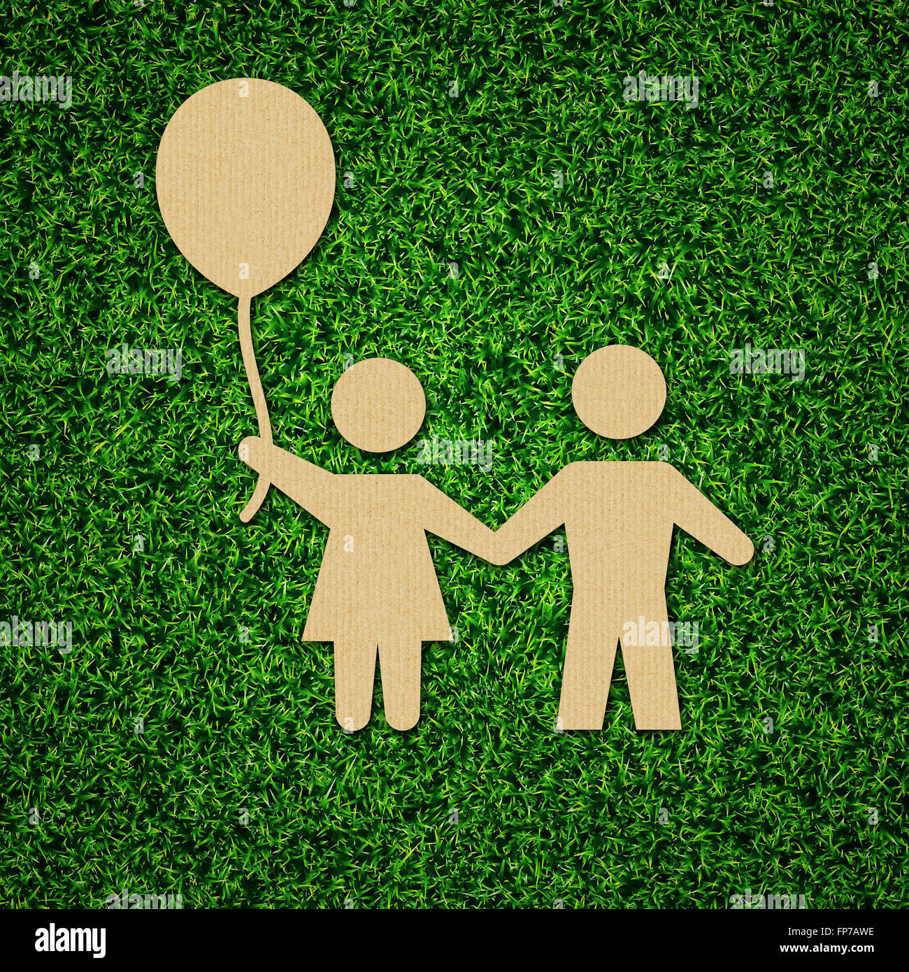 Family concept illustration with cardboard cut out on grass Stock Photo ...