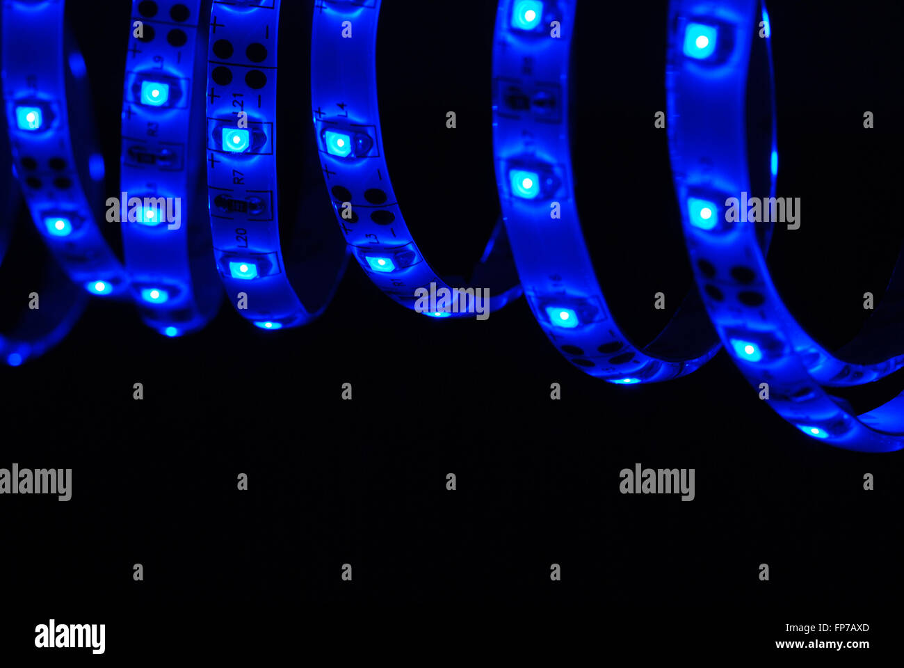 Blue led strip on the black background Stock Photo - Alamy