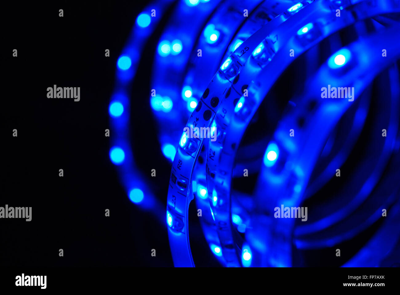 Blue led strip on the black background Stock Photo - Alamy