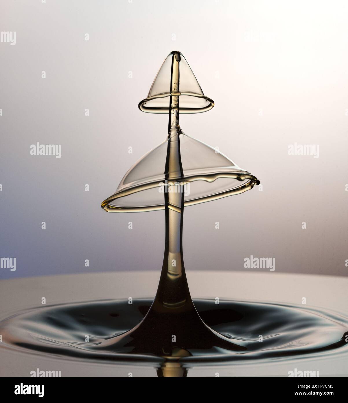 A high speed flash photograph of a three drop liquid collision Stock ...