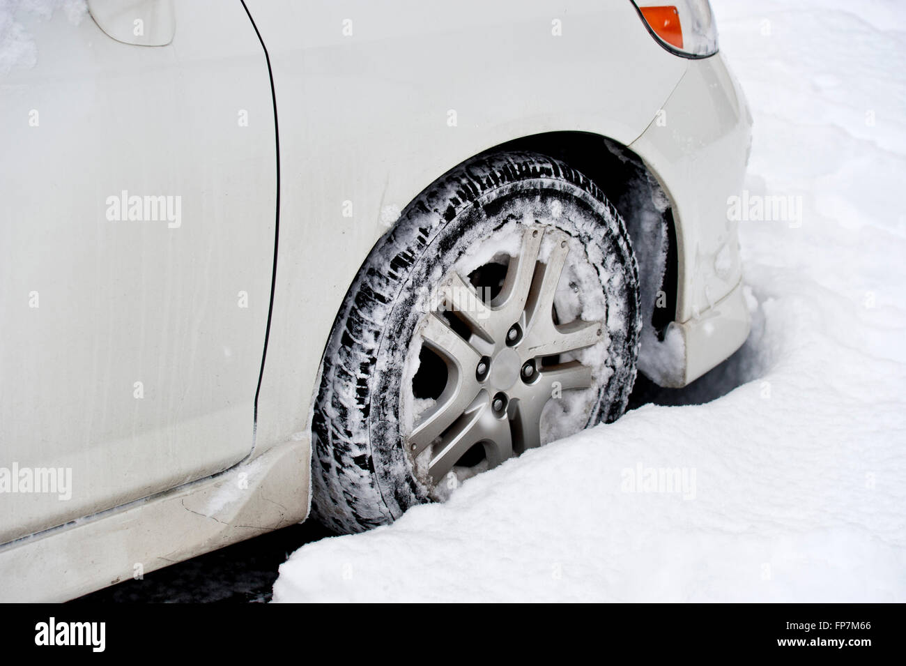 Small Car Front Wheel in Deep Snow Stock Photo - Alamy