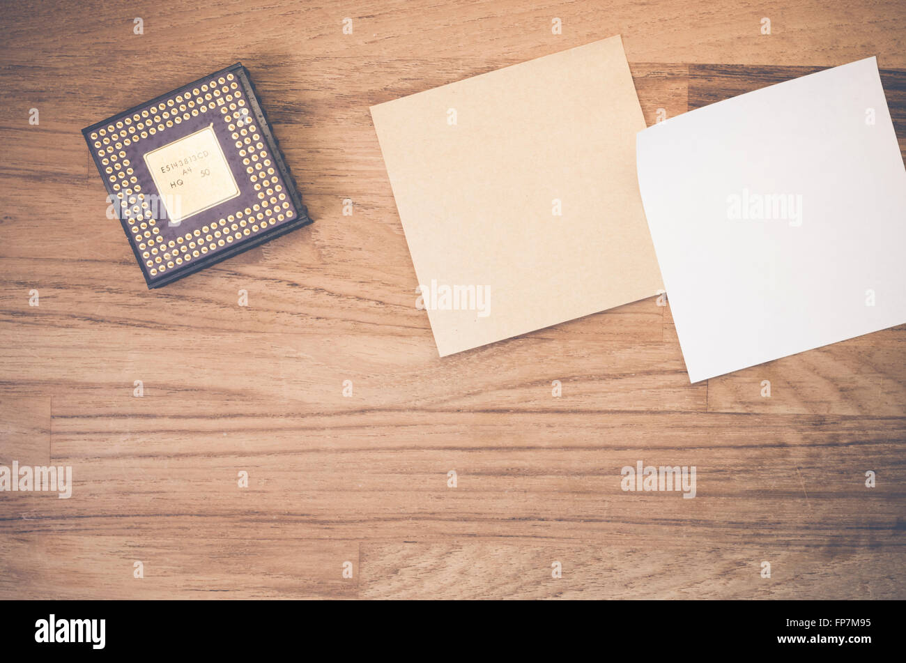 microprocessor package back side view an blank post it on a wood ...