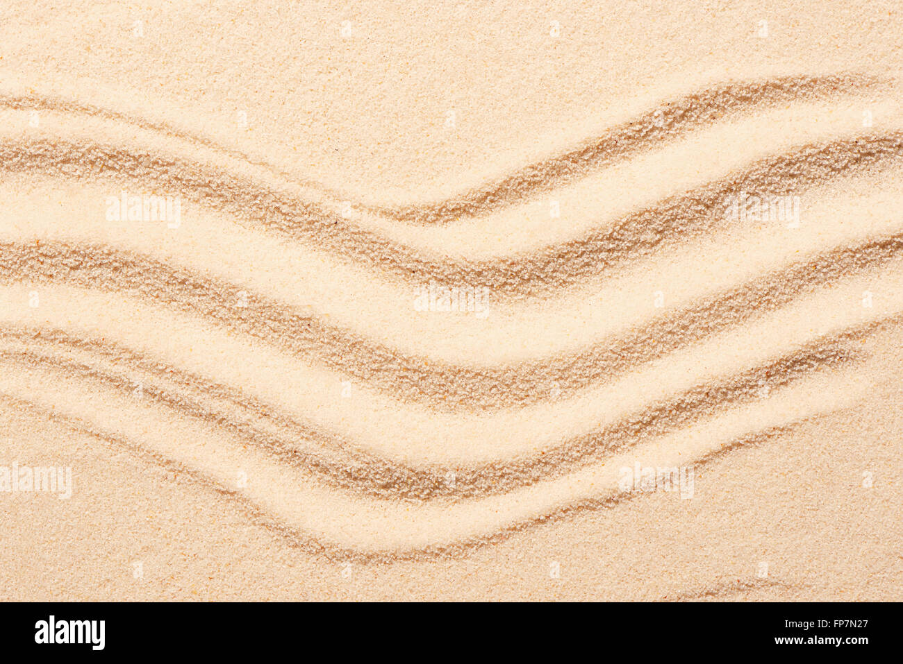 Beach sand with marks of waves. Summer beach background. View from ...