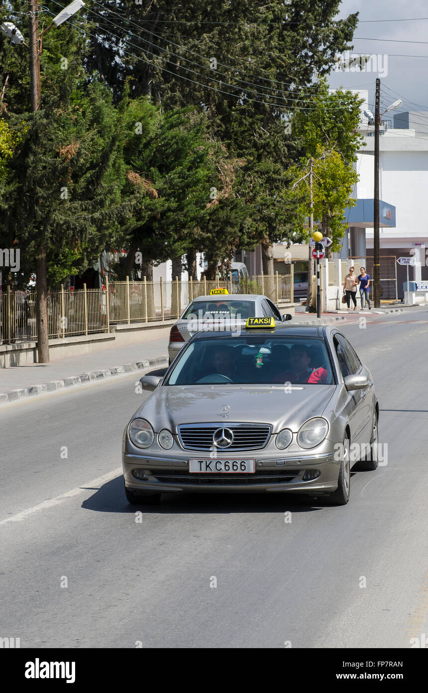 Mercedes taxi driving along a road in the city of Kyrenia, Northern ...