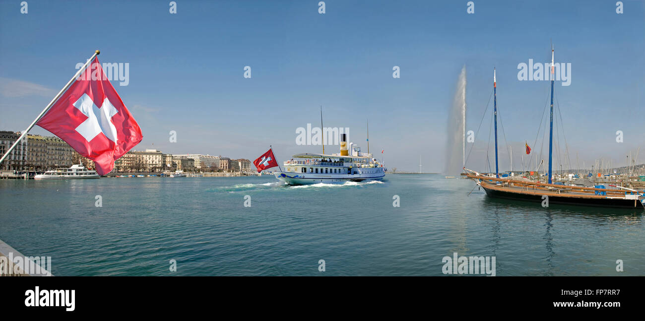 Geneva Harbour on Lake Leman with Jet d'Eau ships and a Swiss flag ...