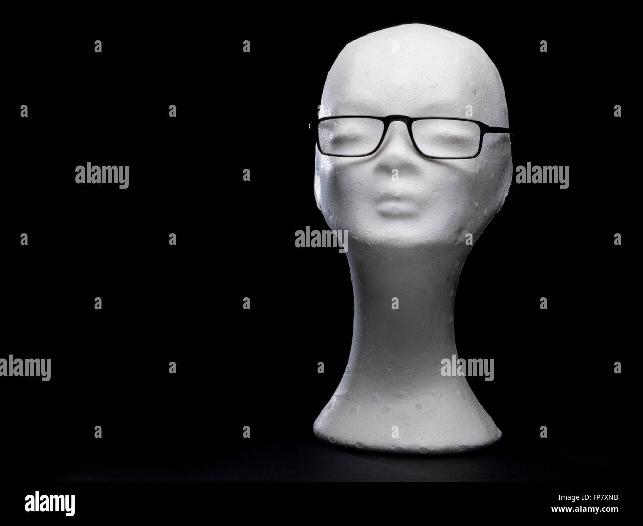 White dummy female head with eyeglasses on black background Stock Photo ...