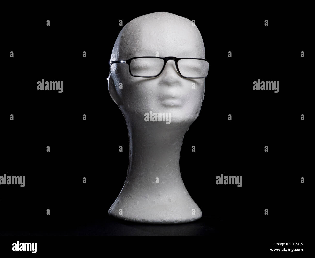 White dummy female head with eyeglasses on black background Stock Photo ...
