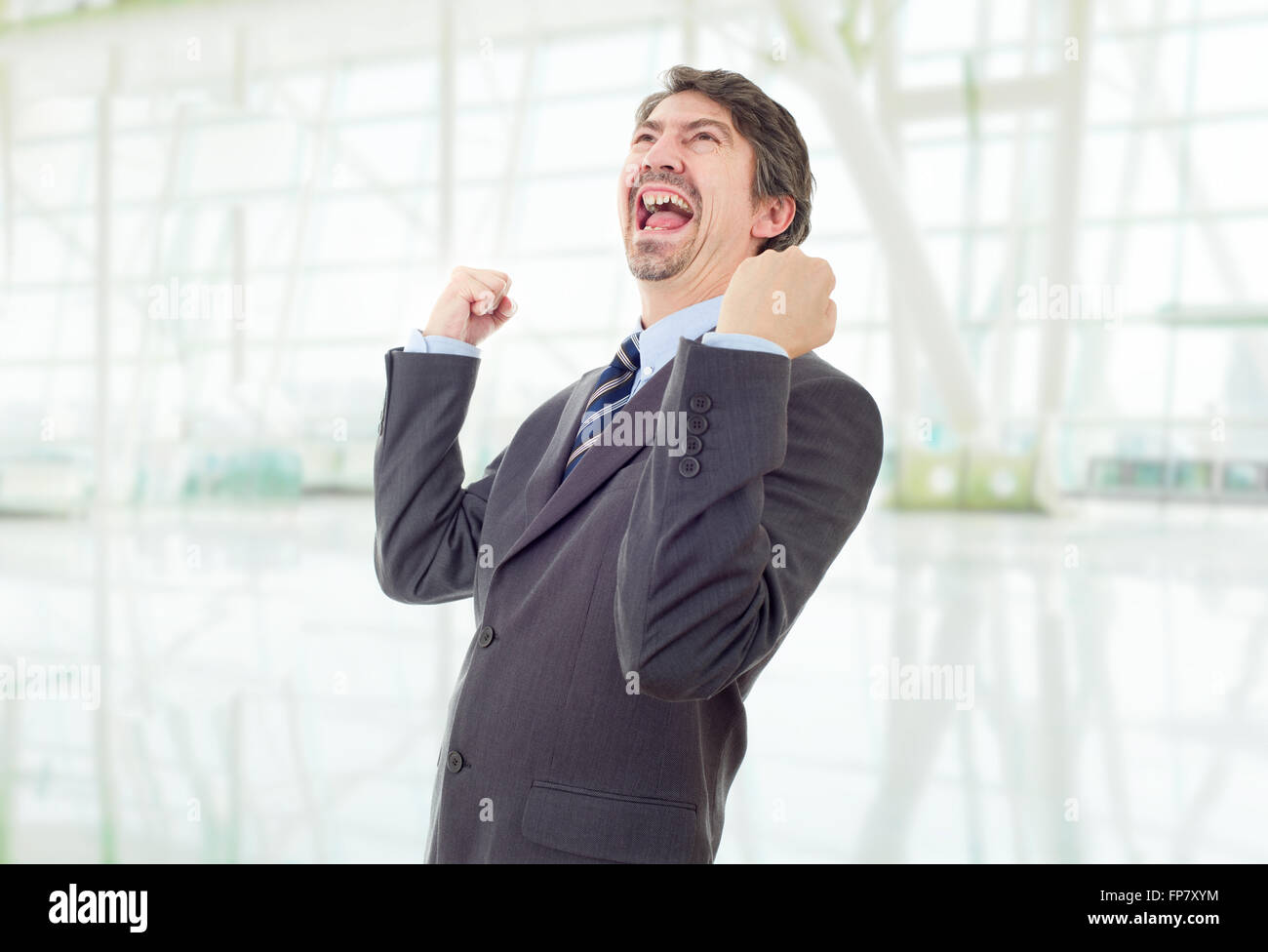 young business man winning, at the office Stock Photo - Alamy