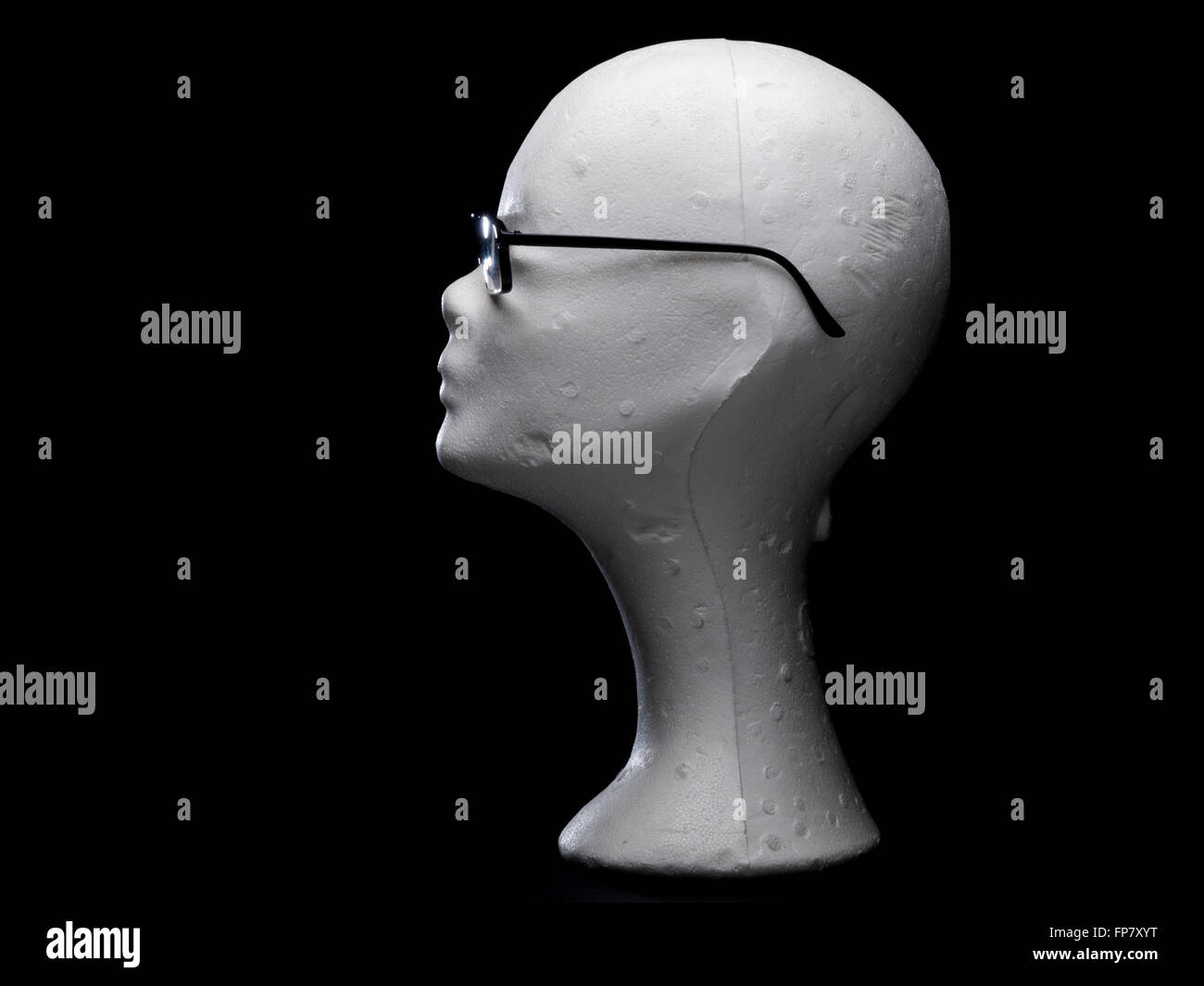 White dummy female head with eyeglasses on black background Stock Photo ...