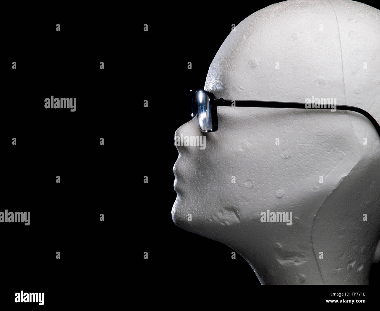 White dummy female head with eyeglasses on black background Stock Photo ...