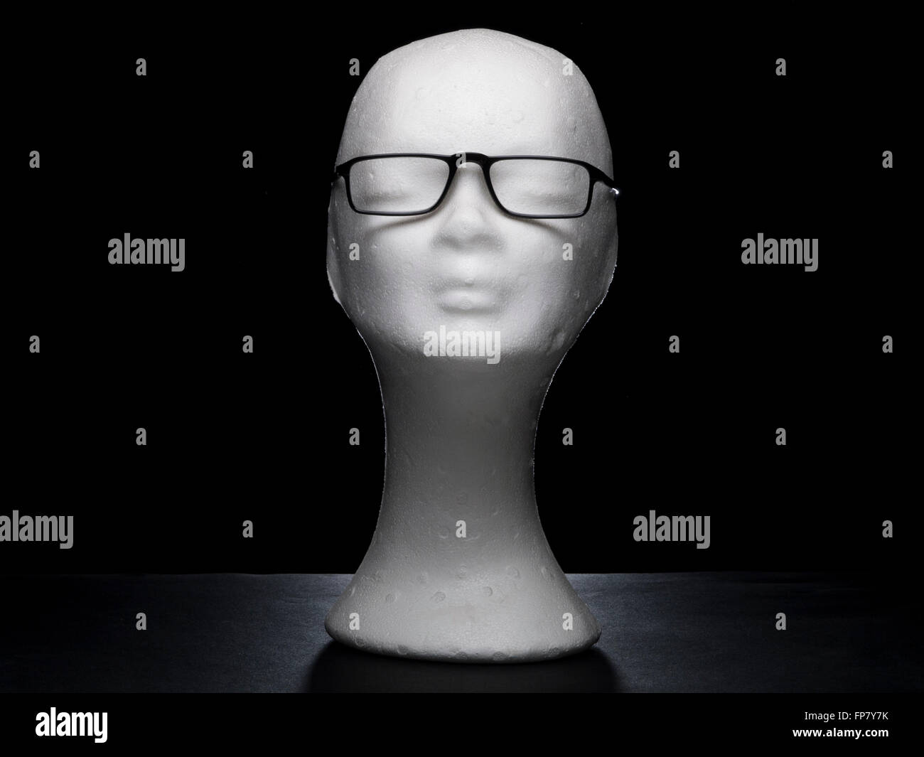 White dummy female head with eyeglasses on black background Stock Photo ...