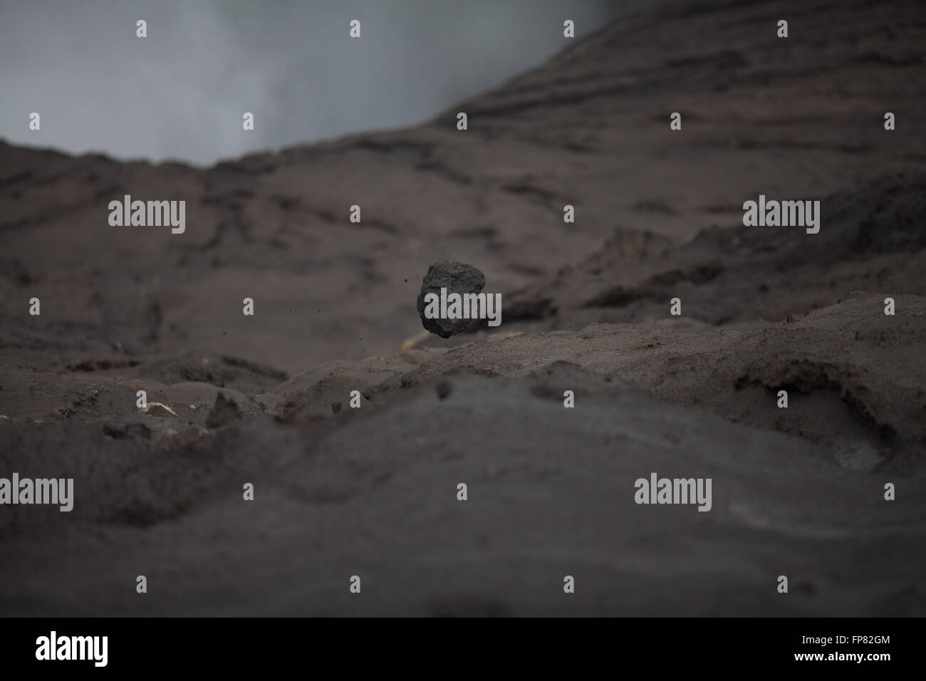 Rock Falling From Volcanic Landscape Stock Photo - Alamy