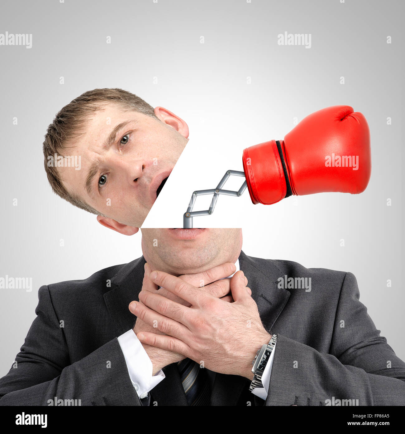 Boxing glove beating from businessmans head on grey background, close ...