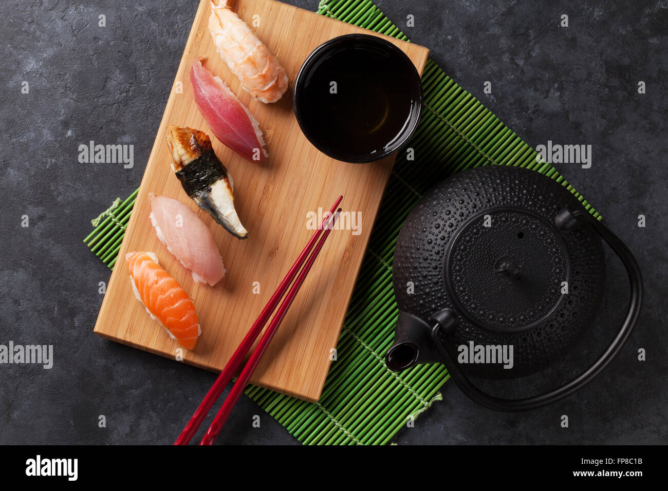Set of sushi and green tea on stone table. Top view Stock Photo - Alamy