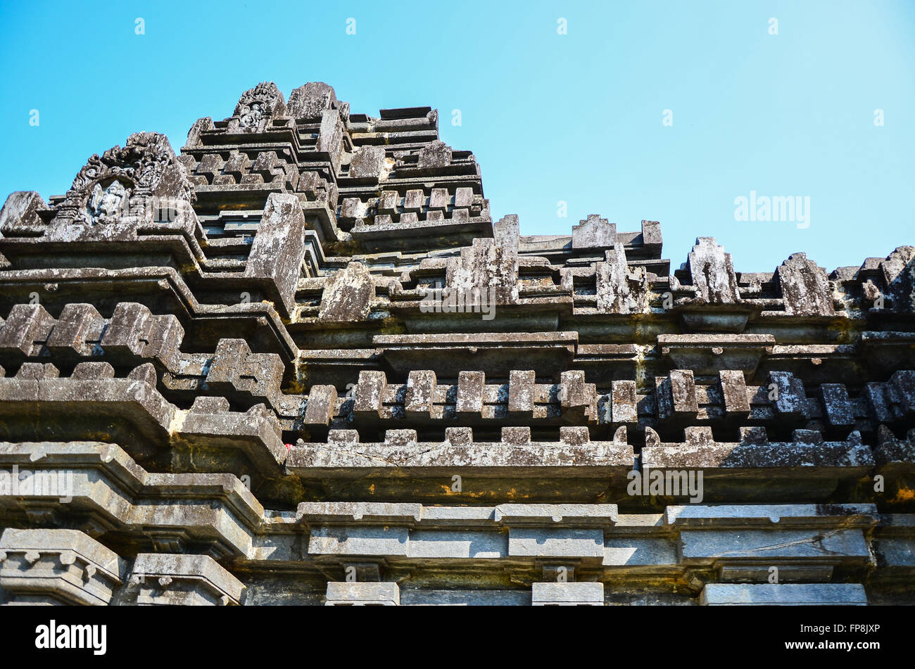 Intricately carved basalt roof details of the Mahadev Temple at Tambdi ...