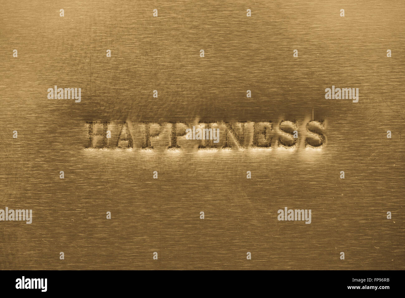 word happiness printed on golden metallic background Stock Photo - Alamy