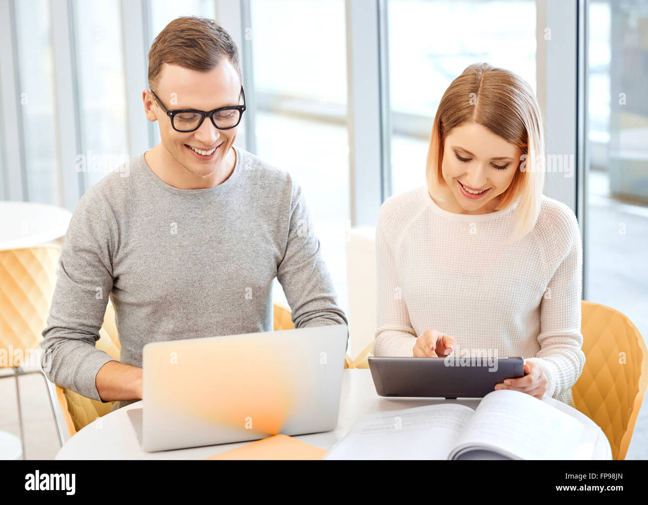 Positive students studying Stock Photo - Alamy