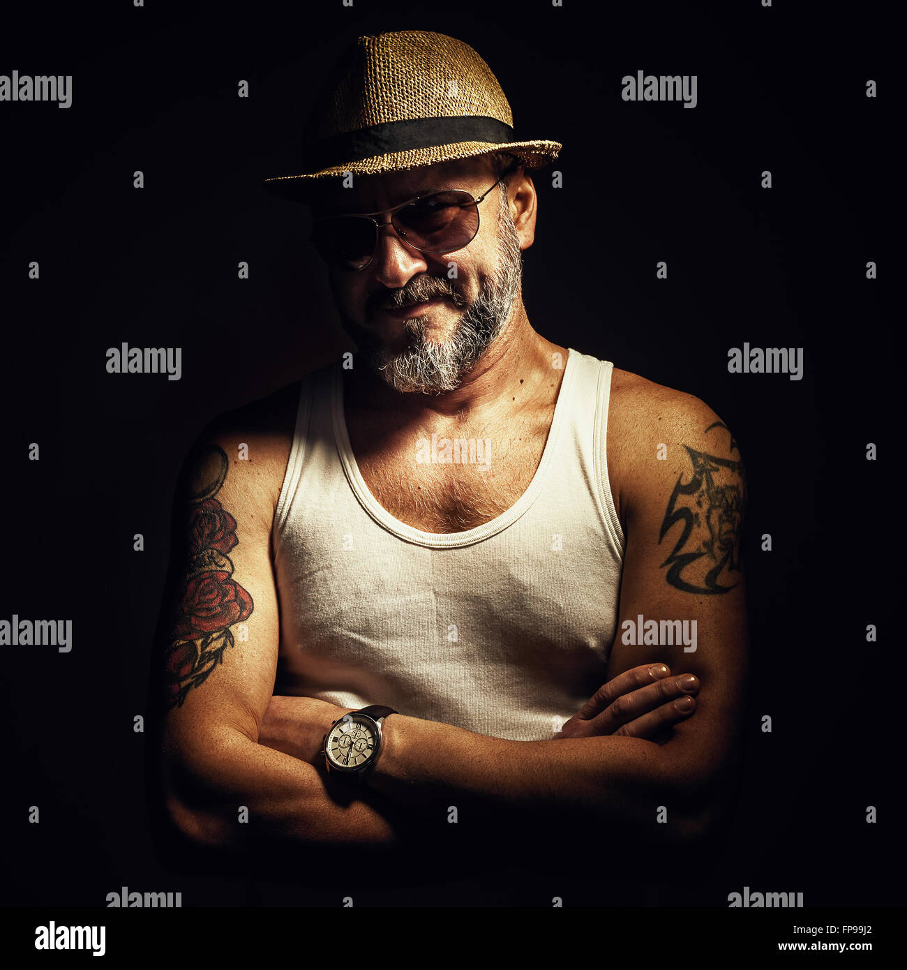 Portrait of an older man showing his tattoo Stock Photo - Alamy
