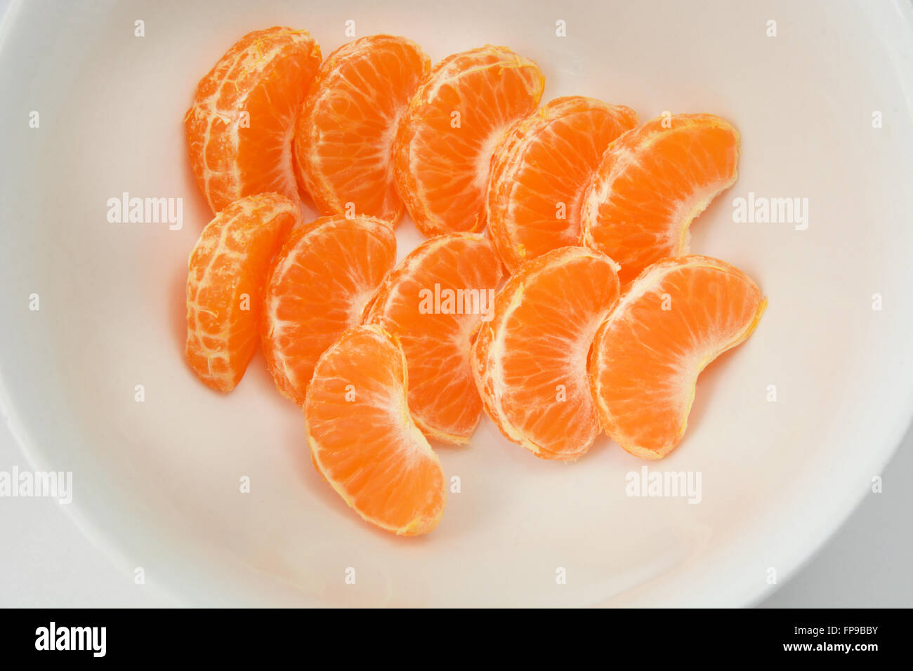 Close up of Mandarin orange slices in white bowl Stock Photo - Alamy