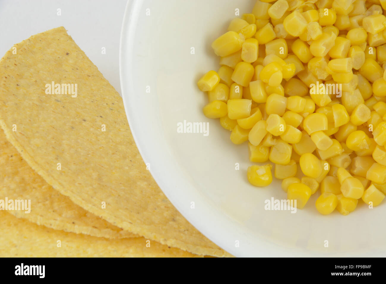 Close up of canned corn and corn taco shells Stock Photo - Alamy