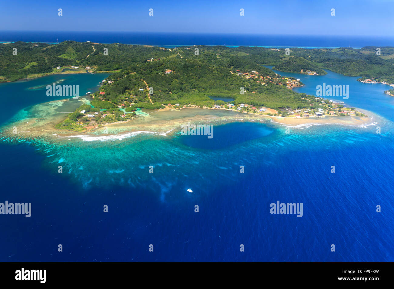 Aerial image vibrant reef surounding Roatan island with beautiful blue ...