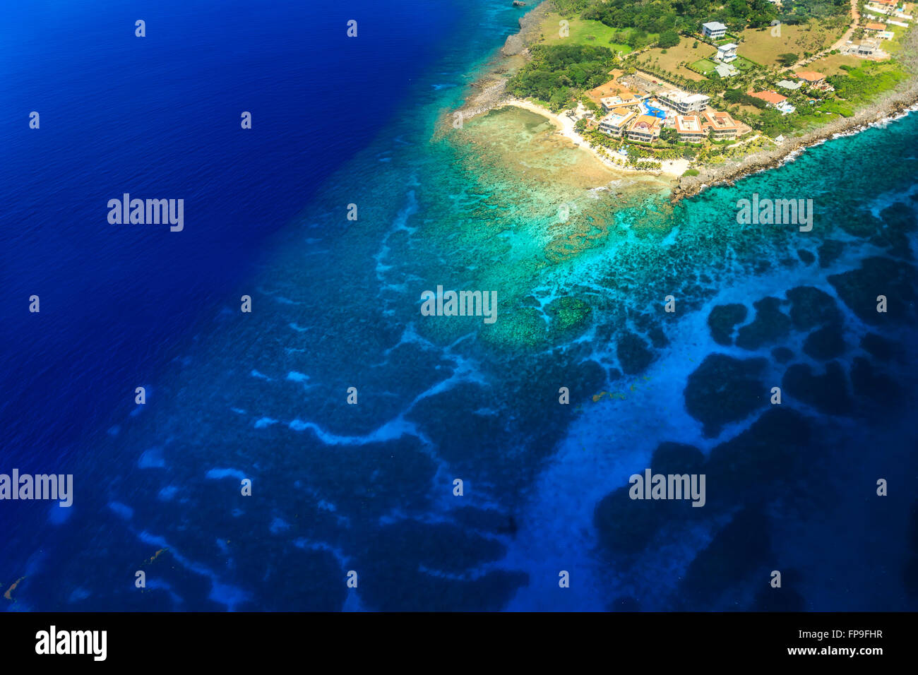 Aerial image of tip of Roatan island and edge of coral reef Stock Photo ...