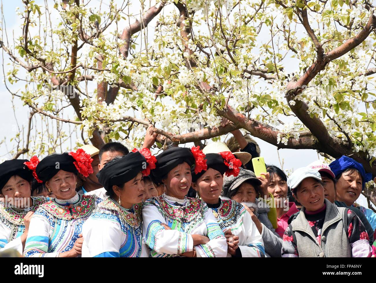 Weishan, China's Yunnan Province. 17th Mar, 2016. Yi people watch ...