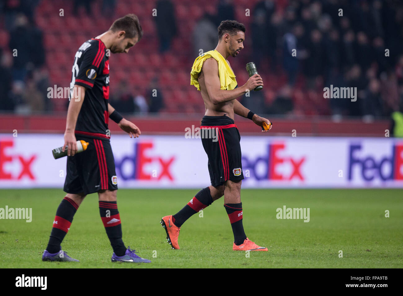 Leverkusen's Vladlen Yurchenko and Karim Bellarabi walk off the pitch ...