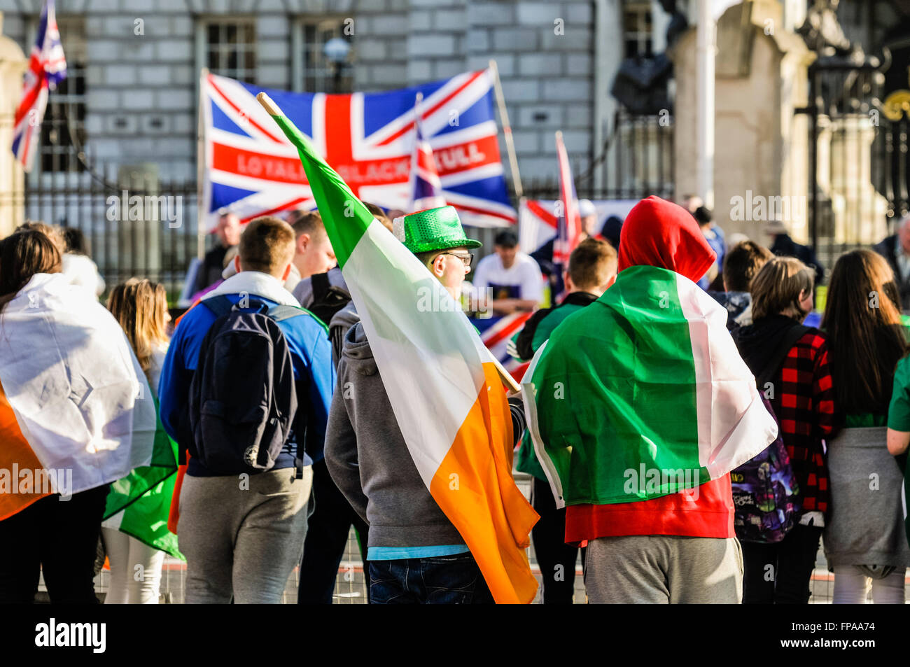 Belfast, Northern Ireland, UK. 17 Mar 2016. Nationalist youths hold up ...