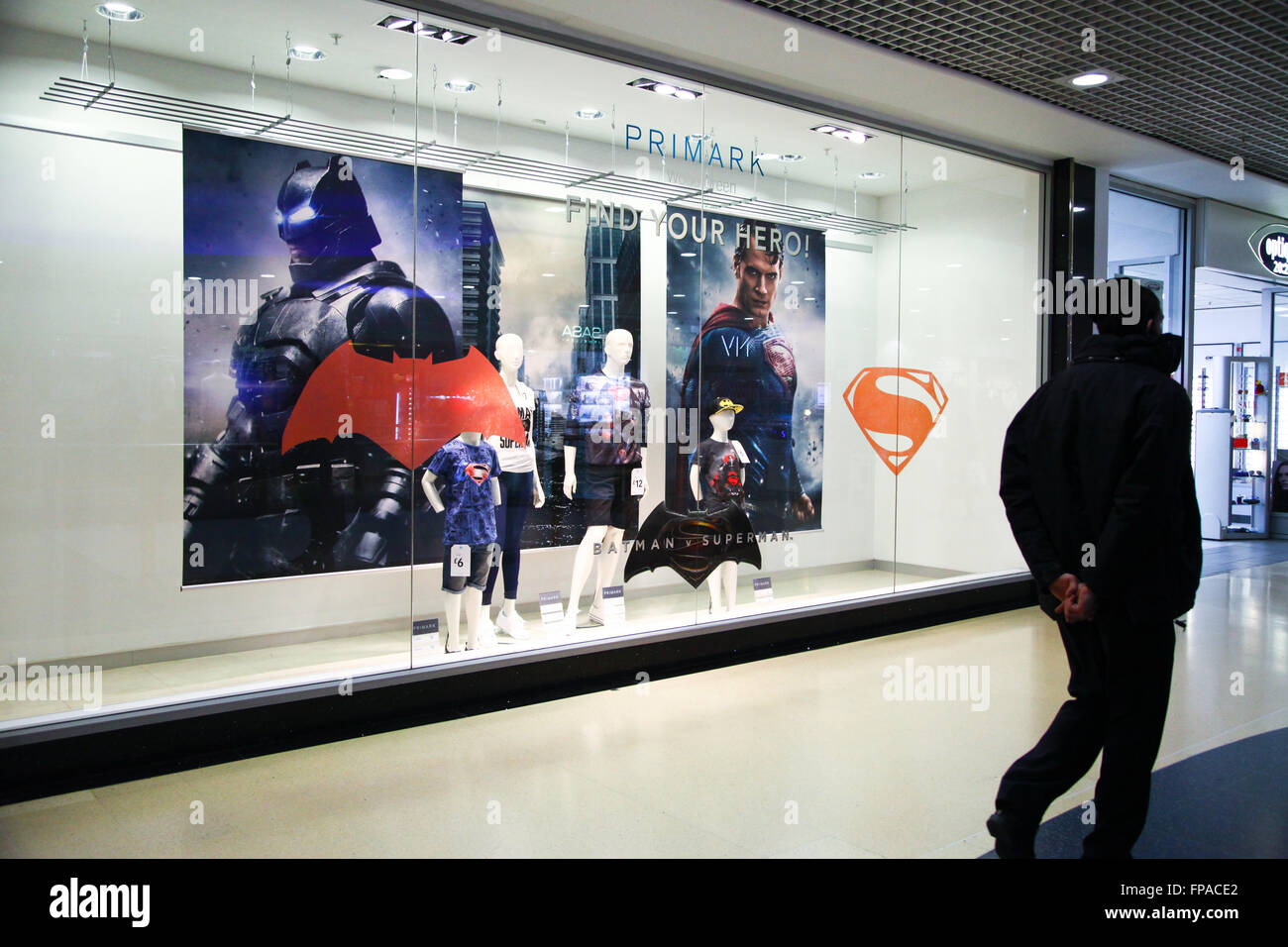 London UK 18 March 2016 - Shopper walks pass the window display of ...