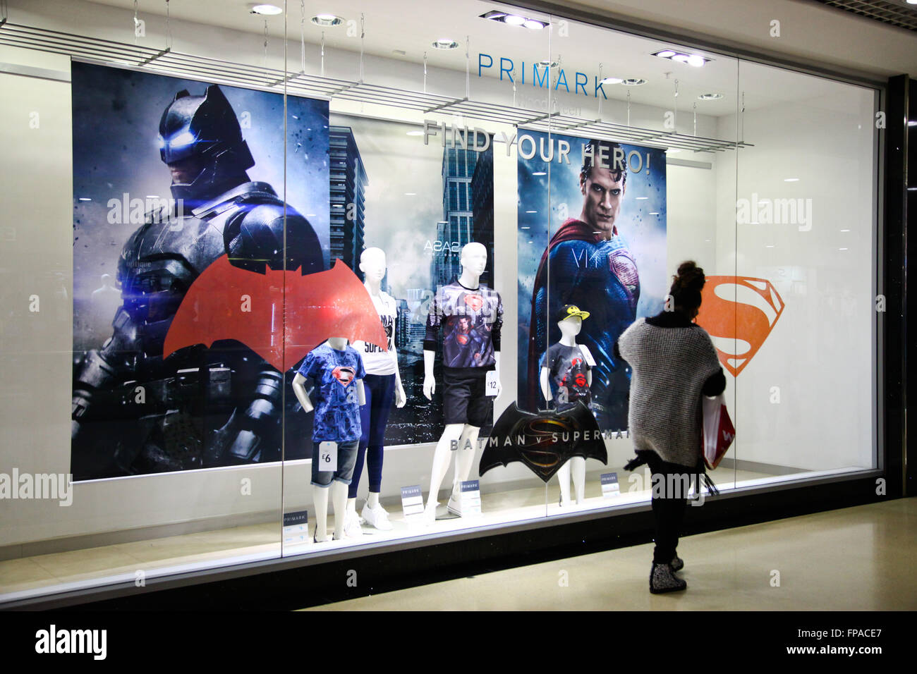 London UK 18 March 2016 - Shopper walks pass the window display of ...