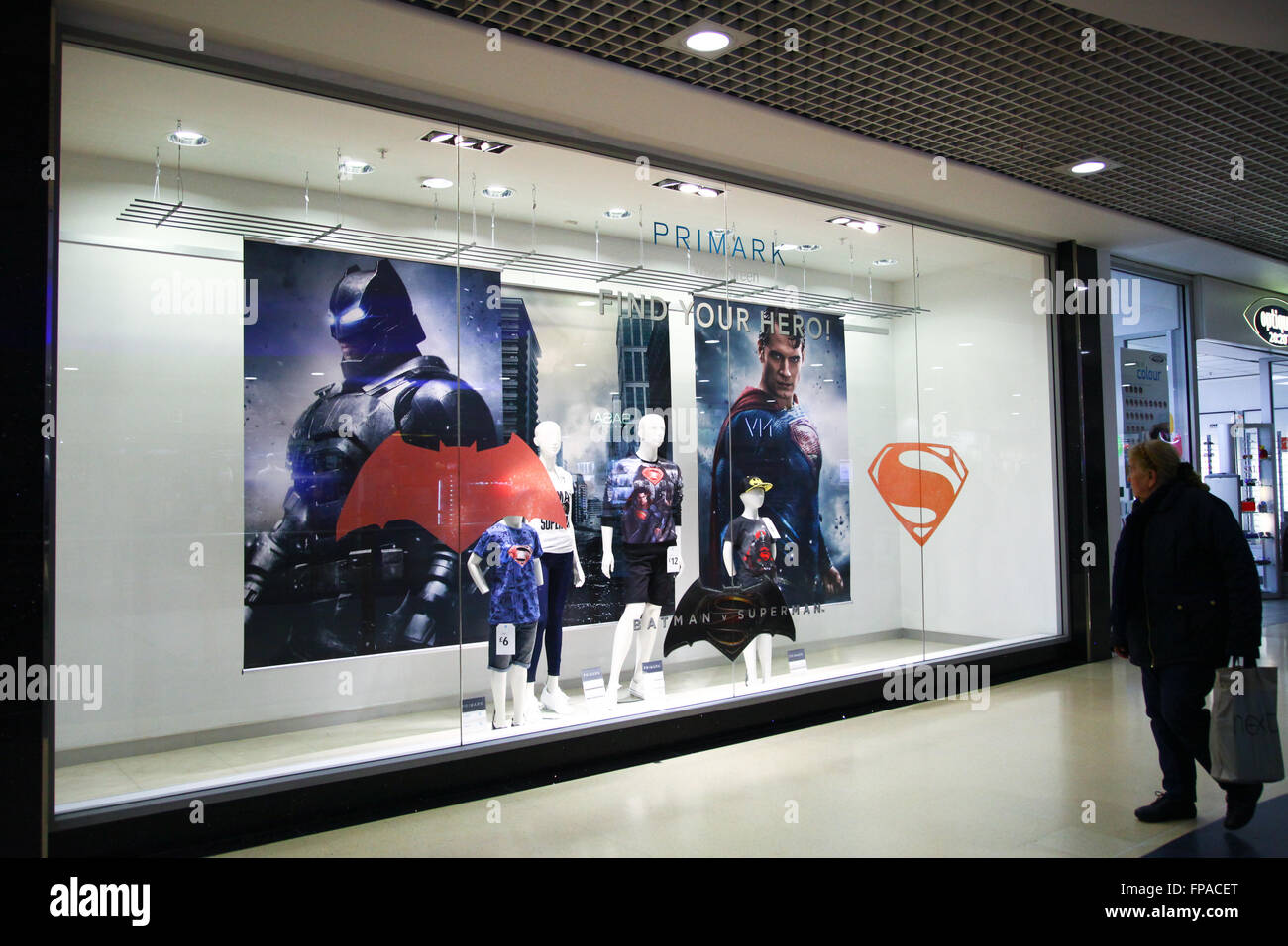 London UK 18 March 2016 - Shopper walks pass the window display of ...