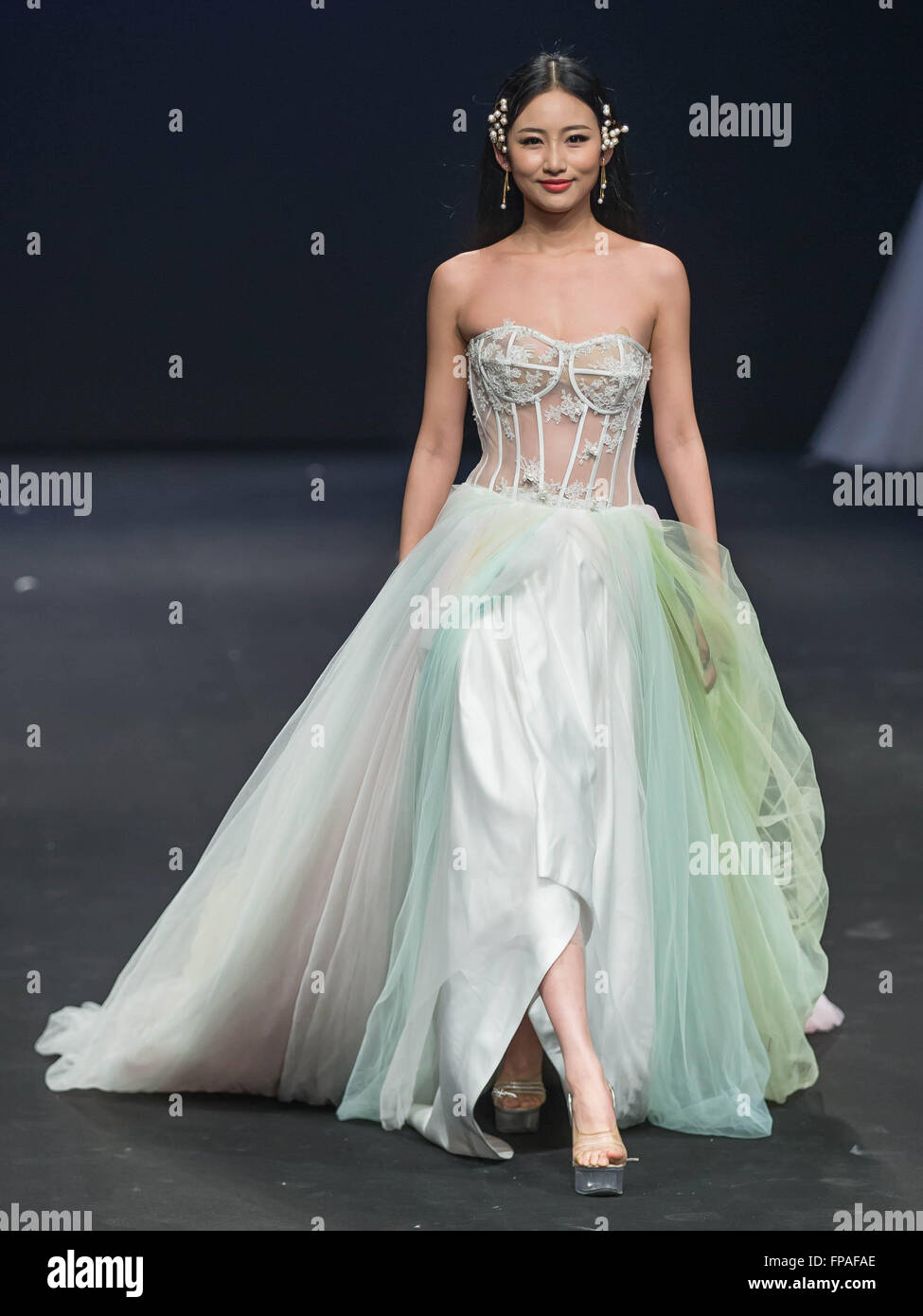 Beijing, China. 18th Mar, 2016. A model presents a creation designed by ...