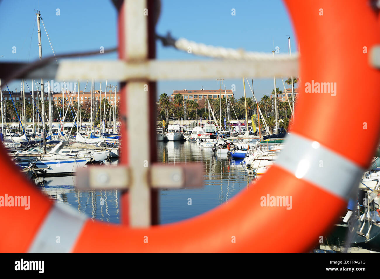 Orange life buoy in sea port Stock Photo - Alamy