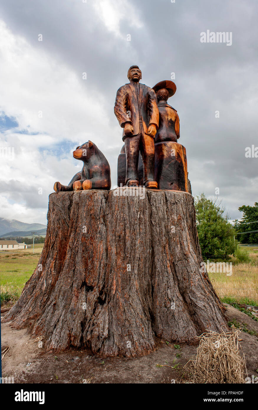tree carving of family and wombat, tasmania, australia Stock Photo - Alamy