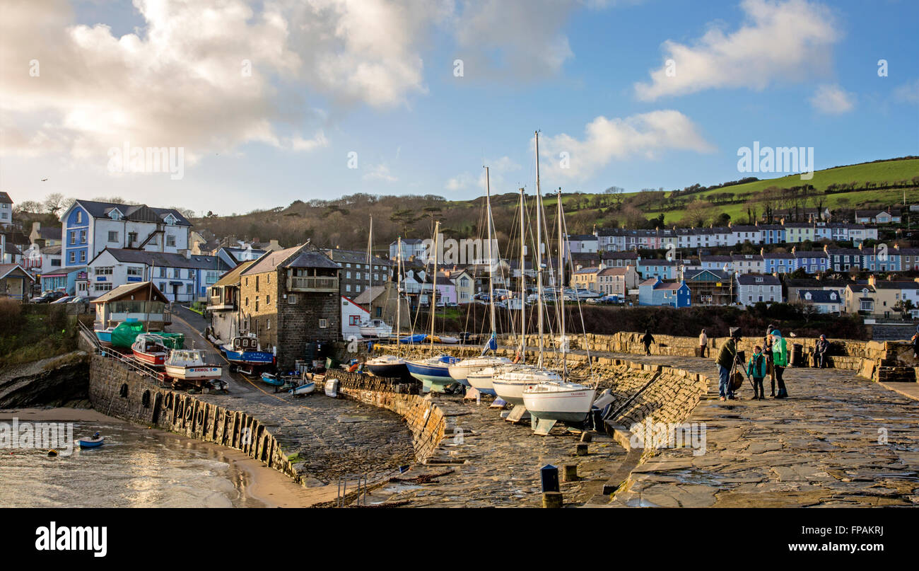 welsh harbour harbor scene at sunset showing photographer using tablet ...