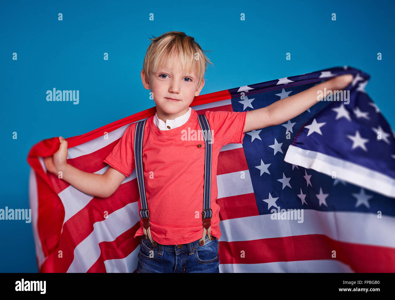 Portrait of American boy posing with flag Stock Photo - Alamy