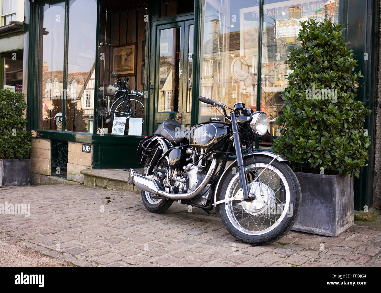 Velocette Venom Clubman motorcycle outside an antiques shop in Burford ...