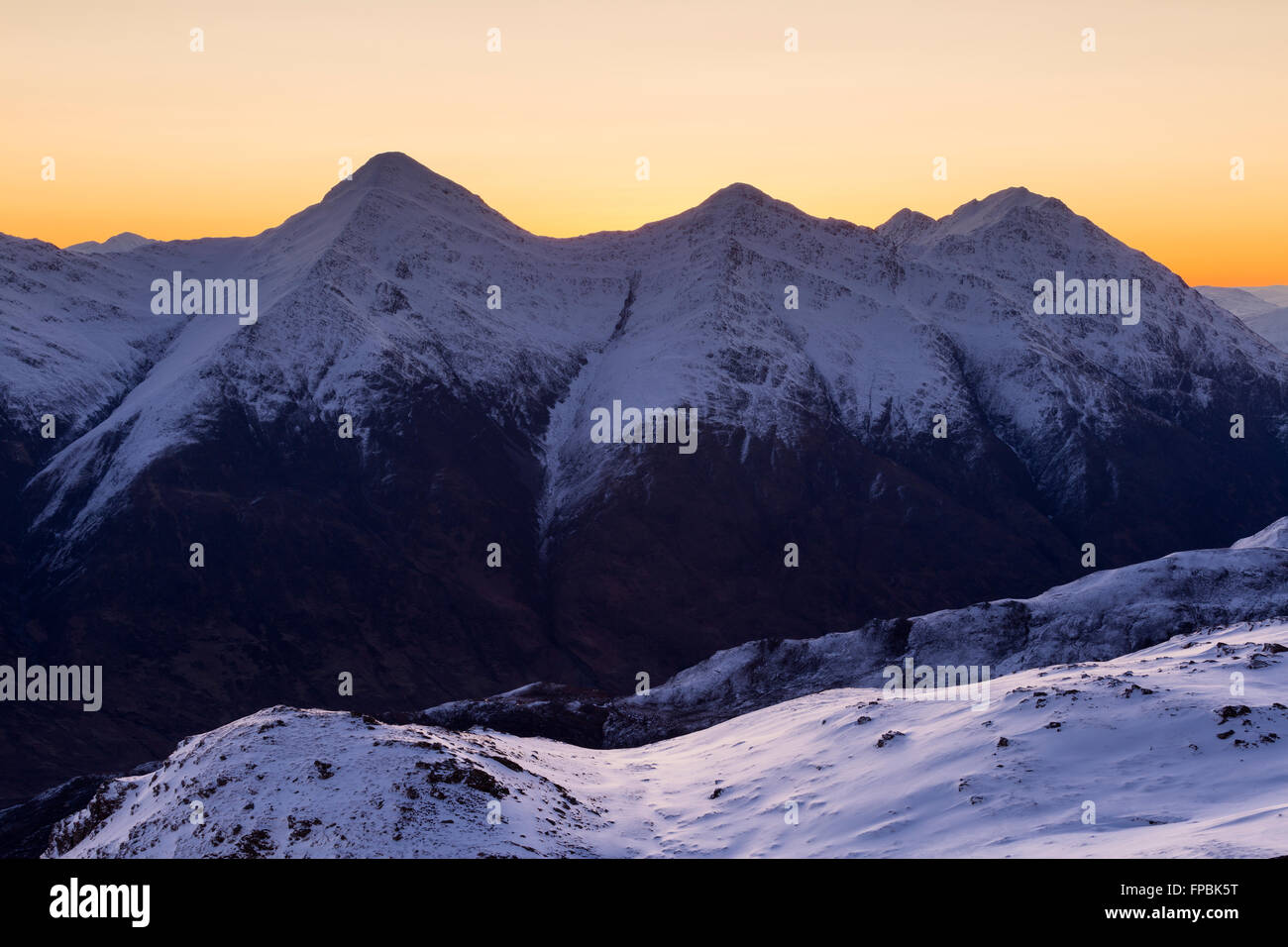 The rugged Kintail ridge as dawn breaks on a clear winter morning ...