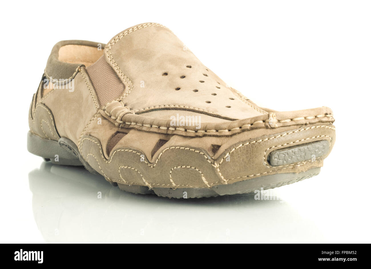 Closeup of Modern beige mens moccasin over white background Stock Photo ...