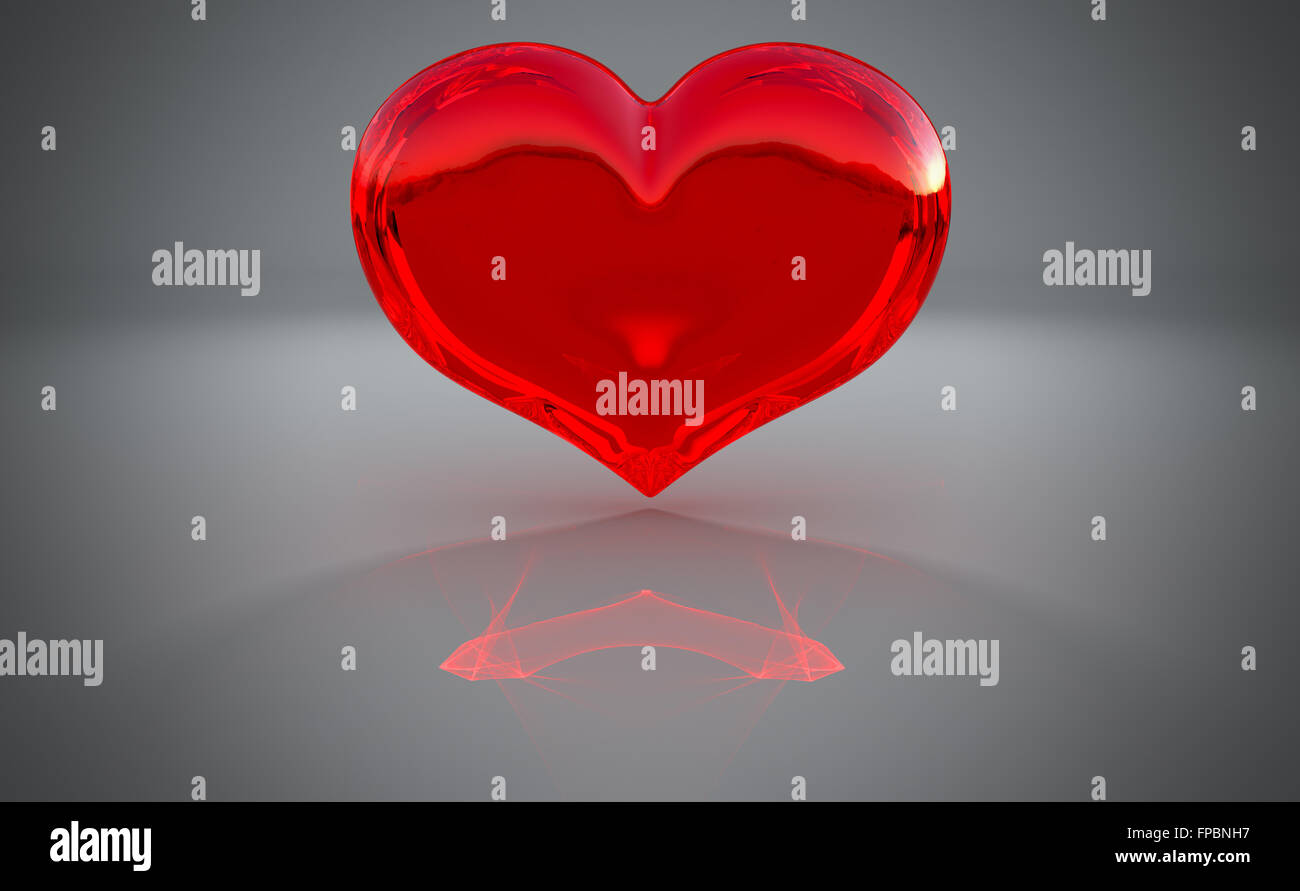 Semitransparent glass heart shape with beautiful reflection over grey ...